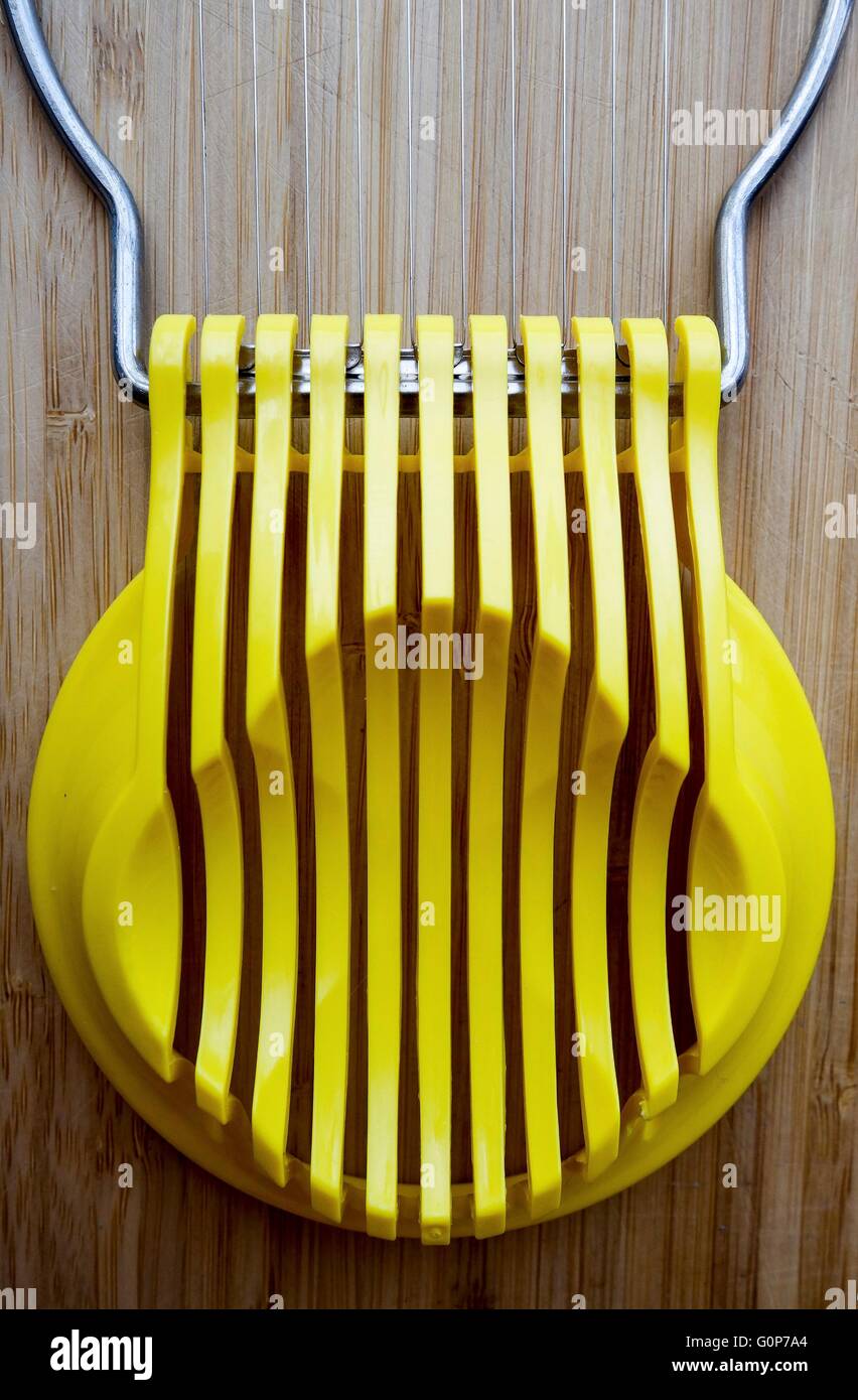 A Yellow Plastic Egg Slicer Stock Photo - Alamy
