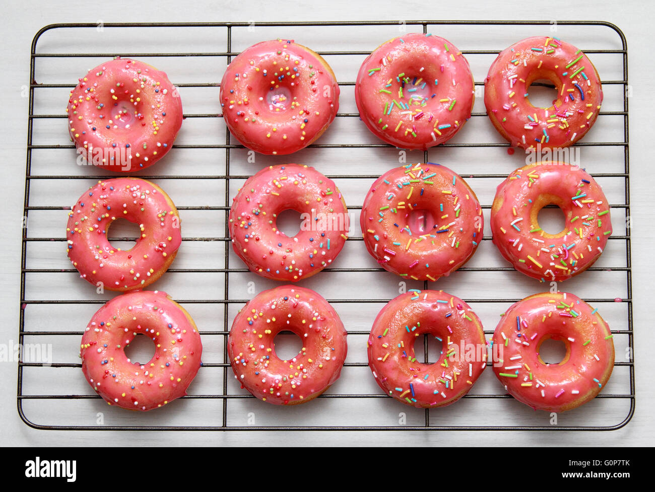 Pink icing doughnut with Sprinkles Isolated on White Background Stock ...