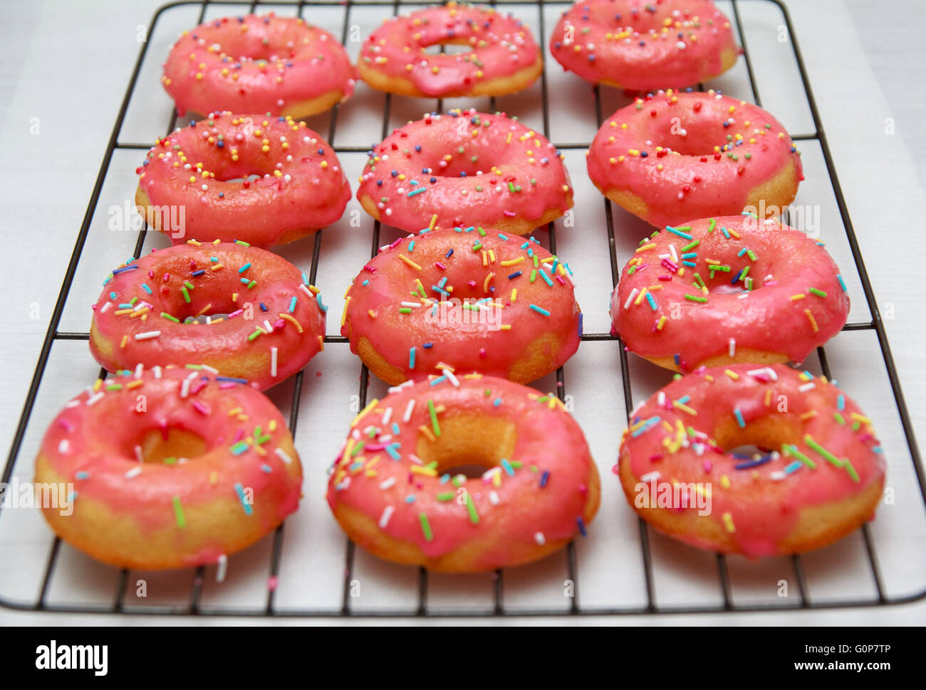 Pink icing doughnut with Sprinkles Isolated on White Background Stock ...