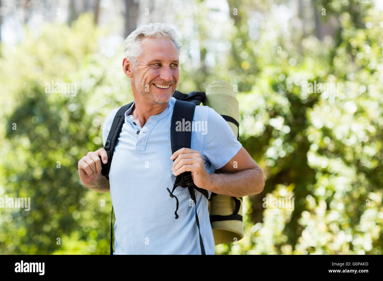 Man smiling and hiking Stock Photo - Alamy