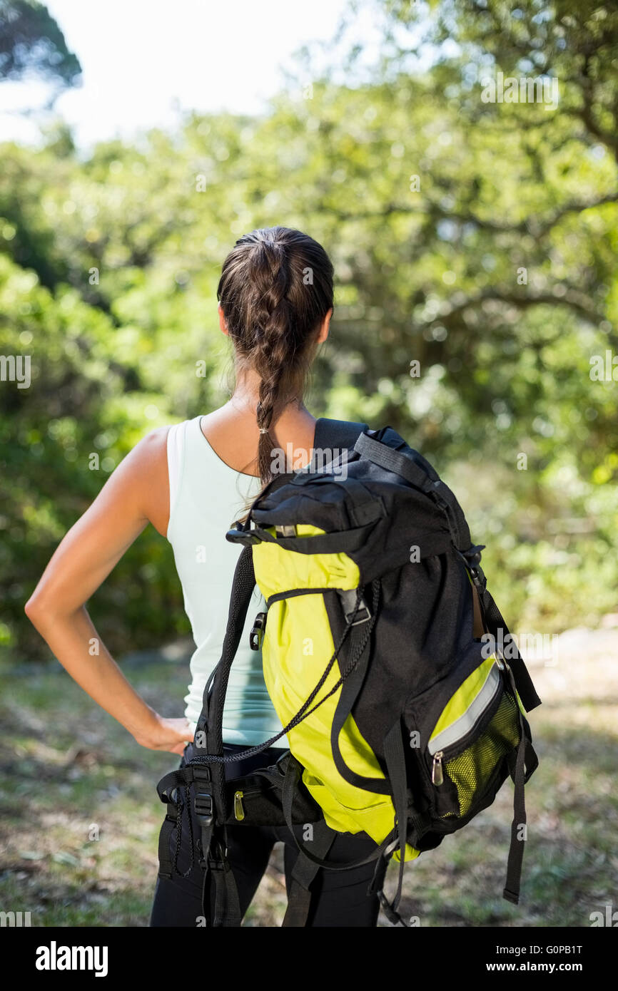 Woman front the back posing with her backpack Stock Photo - Alamy