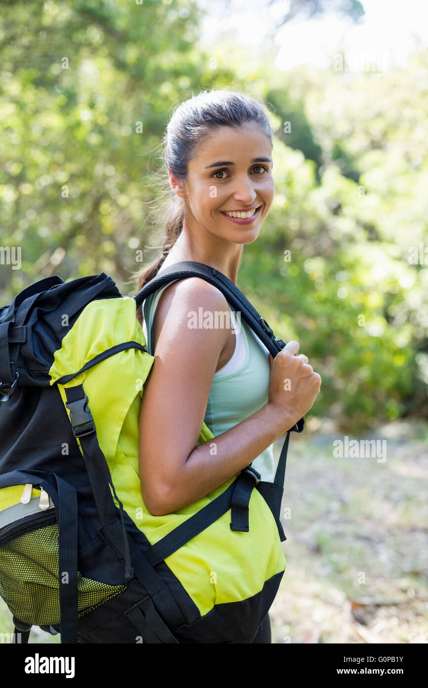 Woman smiling and posing with her backpack Stock Photo - Alamy