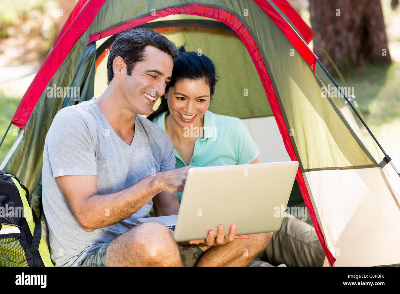 Adult couple using laptop hi-res stock photography and images - Alamy