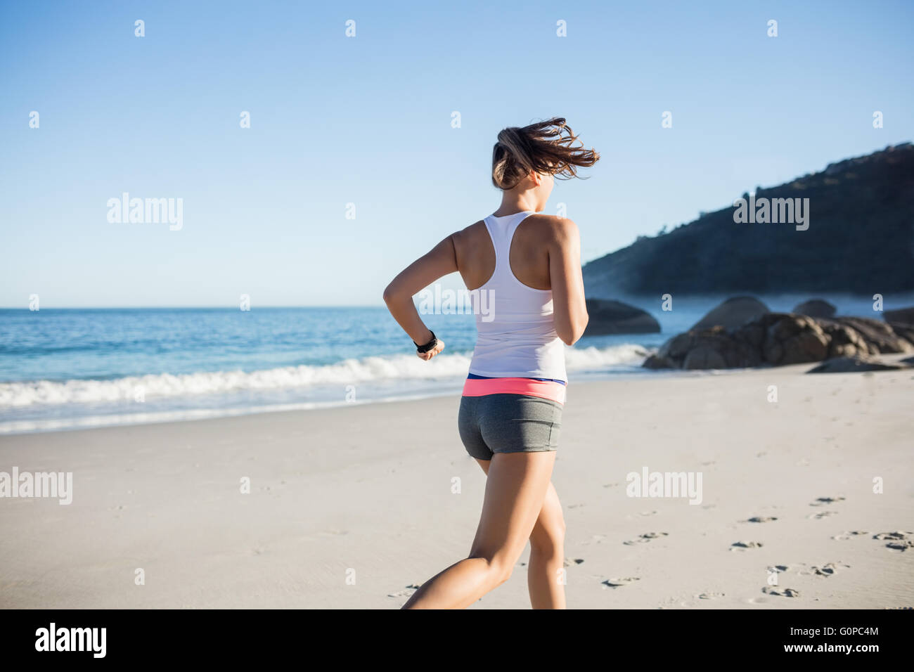 Fit woman on the beach Stock Photo - Alamy