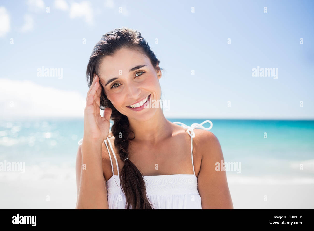 Portrait of smiling woman on the beach Stock Photo - Alamy