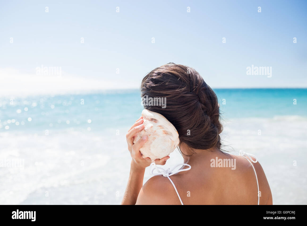 Listening to ocean hi-res stock photography and images - Alamy