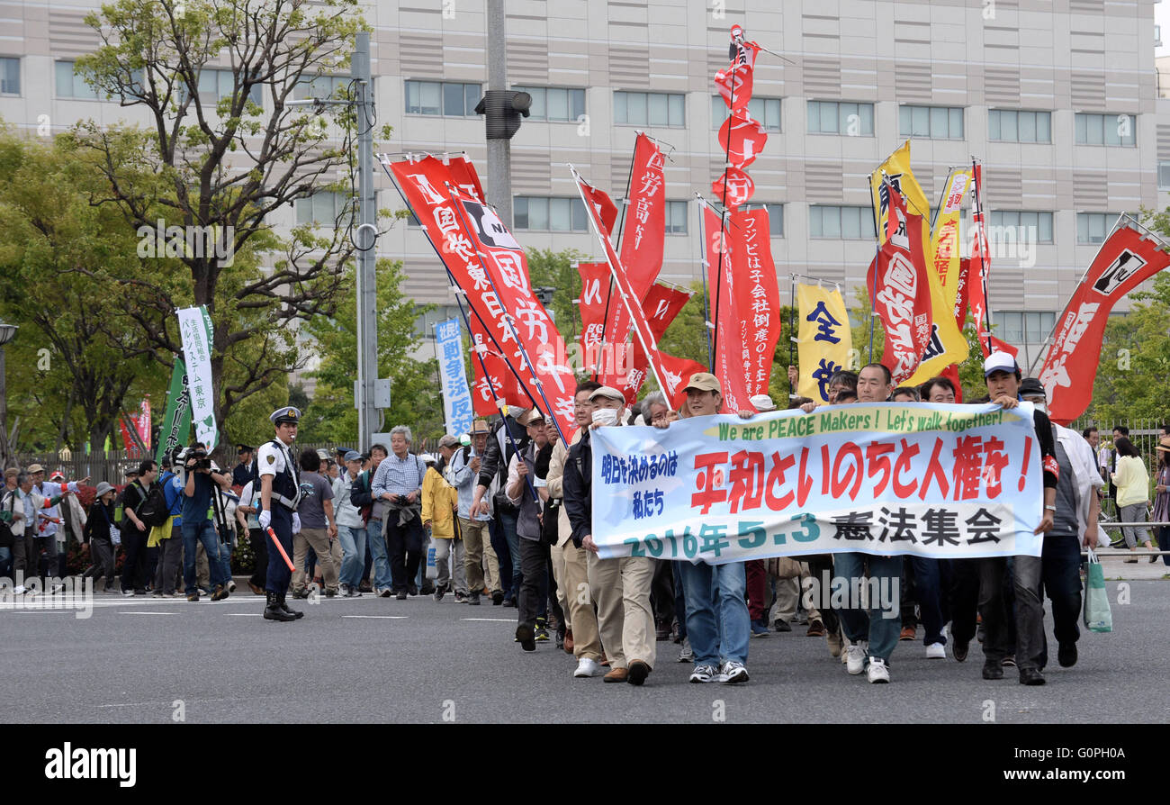 Tokyo, Japan. 3rd May, 2016. Citizens holding placards and banners ...