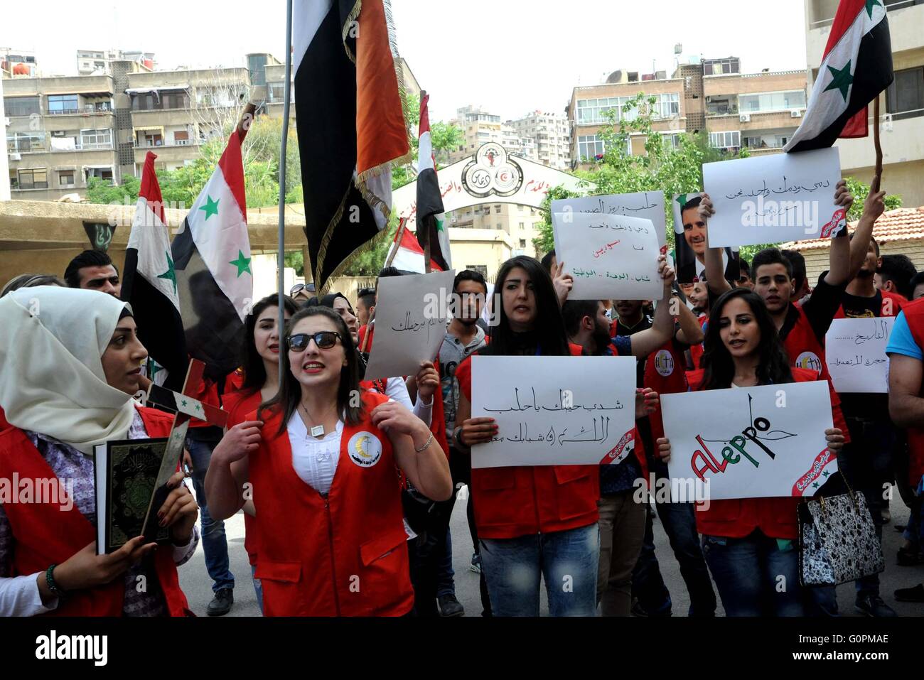Damascus, Syria. 3rd May, 2016. Syrian university students hold banners ...