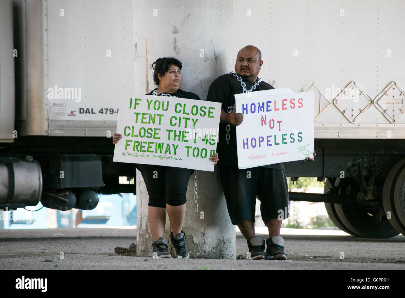 Dallas, USA. 3rd May, 2016. Two tramps holding posters protest against ...