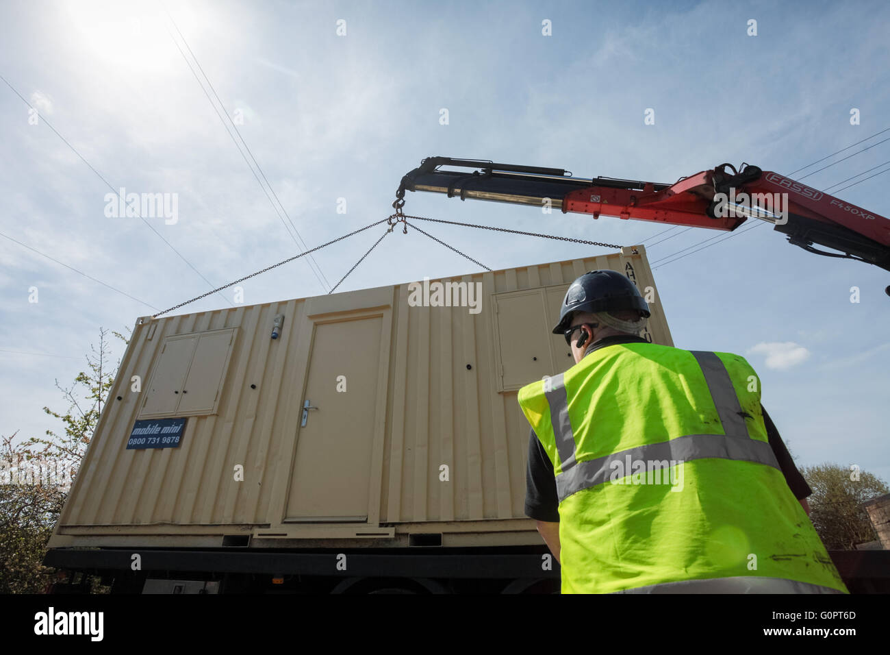 A mobile voting station or polling booth is being delivered and put ...