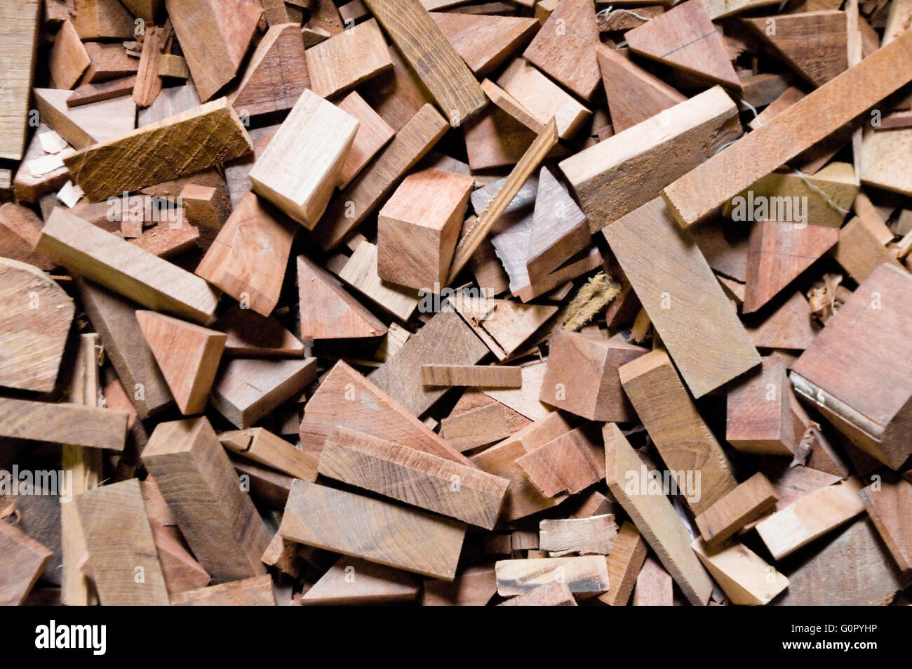 Cut wood pieces remaining from carpenter handcraft. They are piled up ...