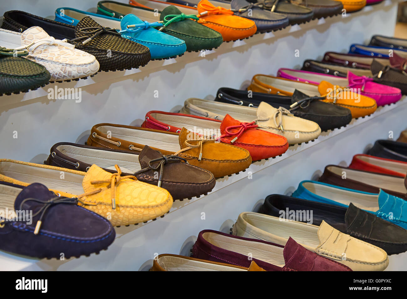variety of the colorful leather shoes in the shop Stock Photo - Alamy