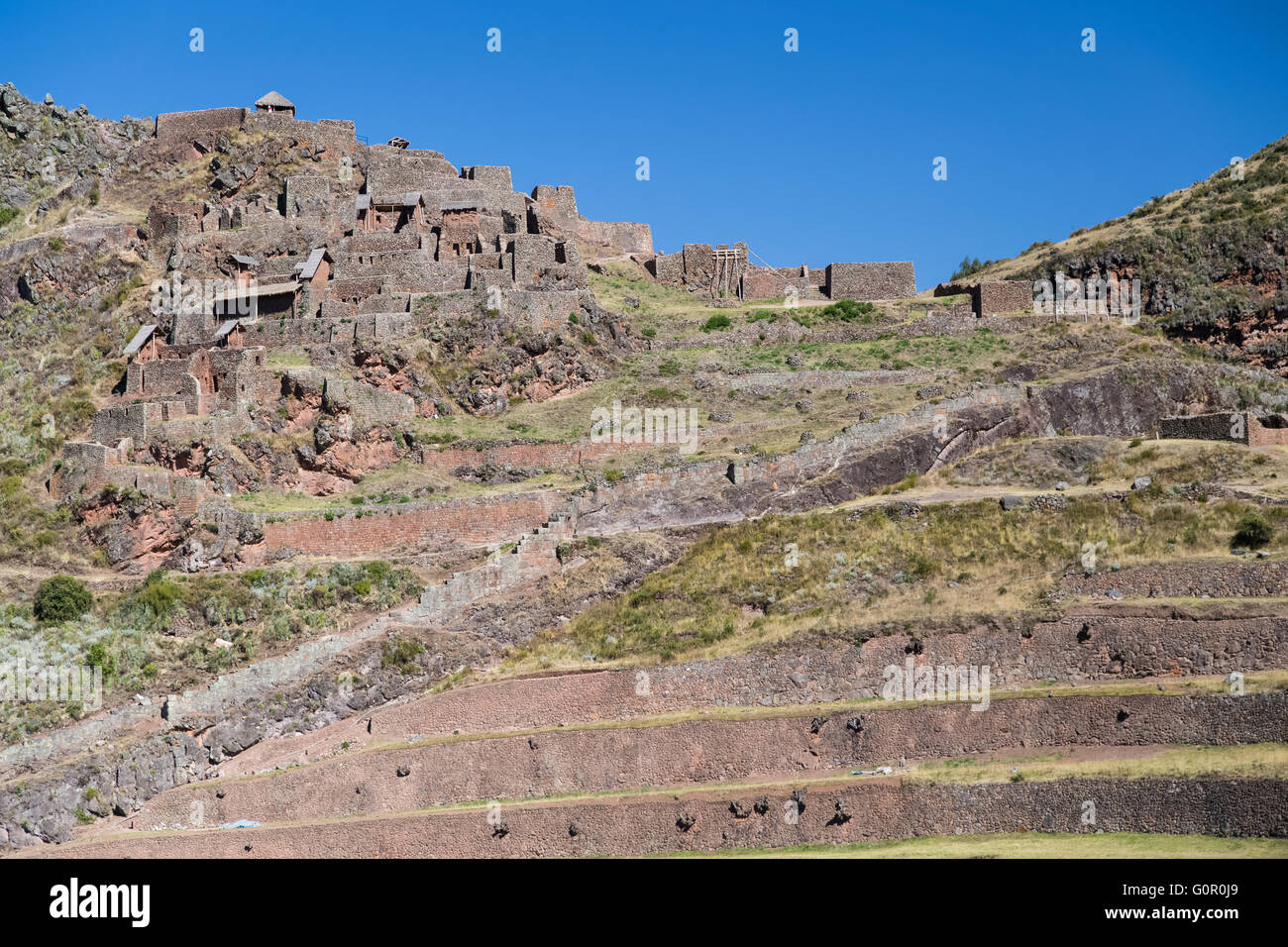 Inca agricultural terraces and village ruins in Pisaq, Peru Stock Photo ...