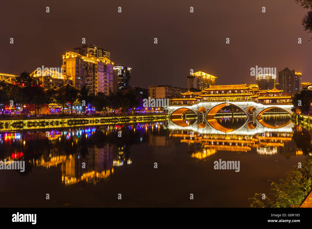 Night view of Anshun Bridge with beautiful illumination and reflection ...