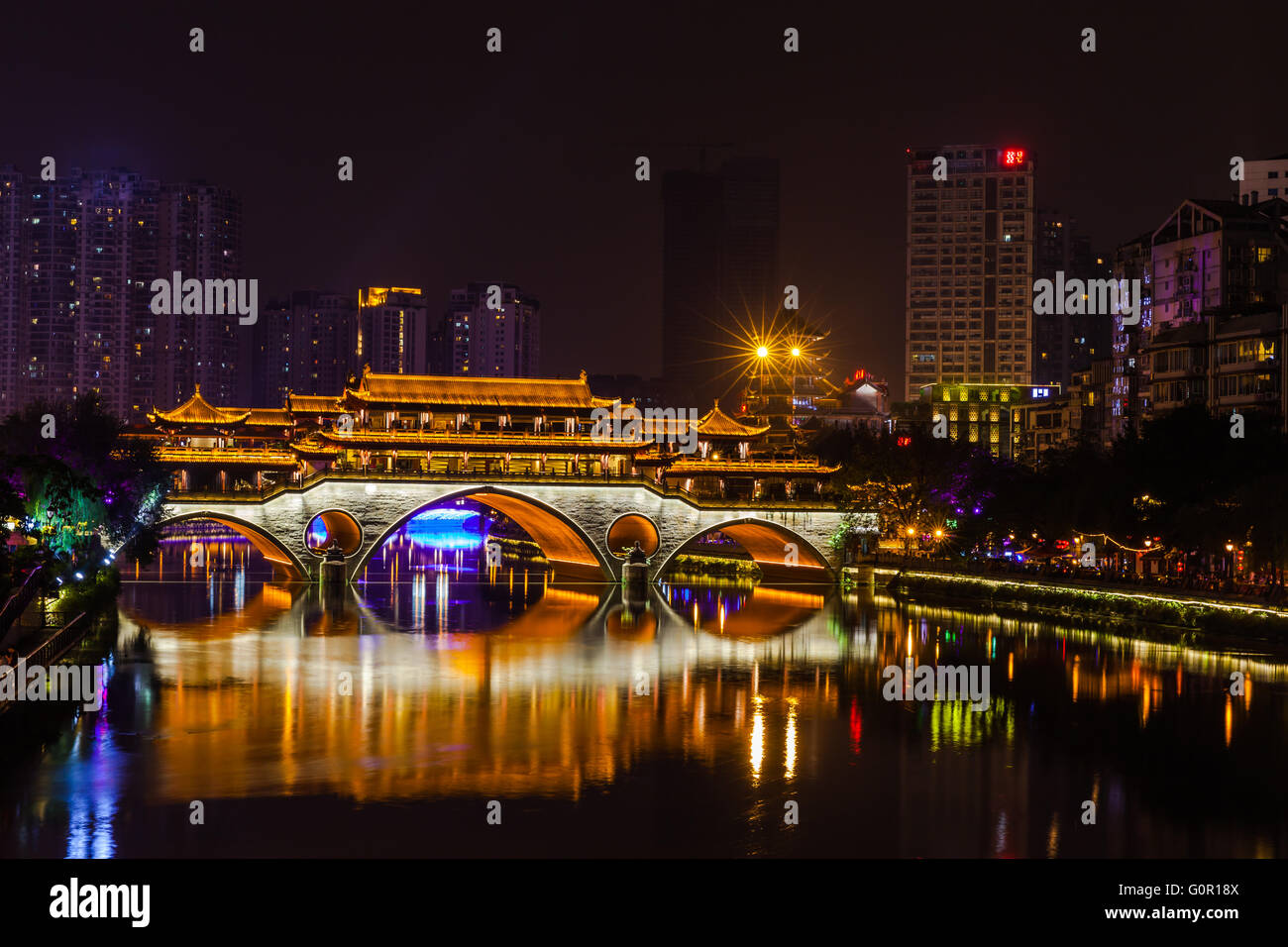 Night view of Anshun Bridge with beautiful illumination and reflection ...