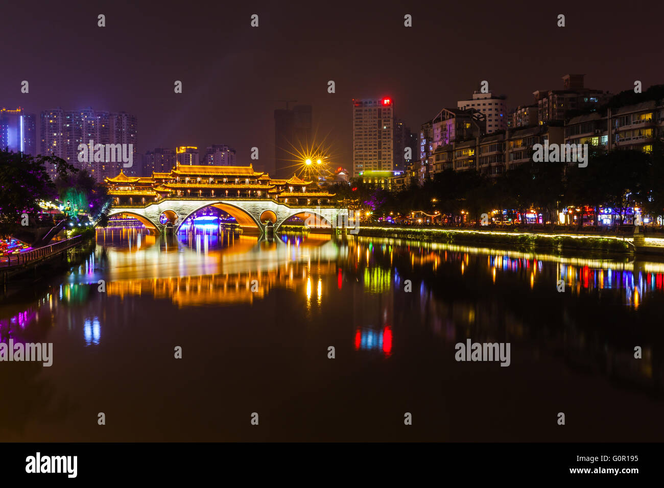 Night view of Anshun Bridge with beautiful illumination and reflection ...