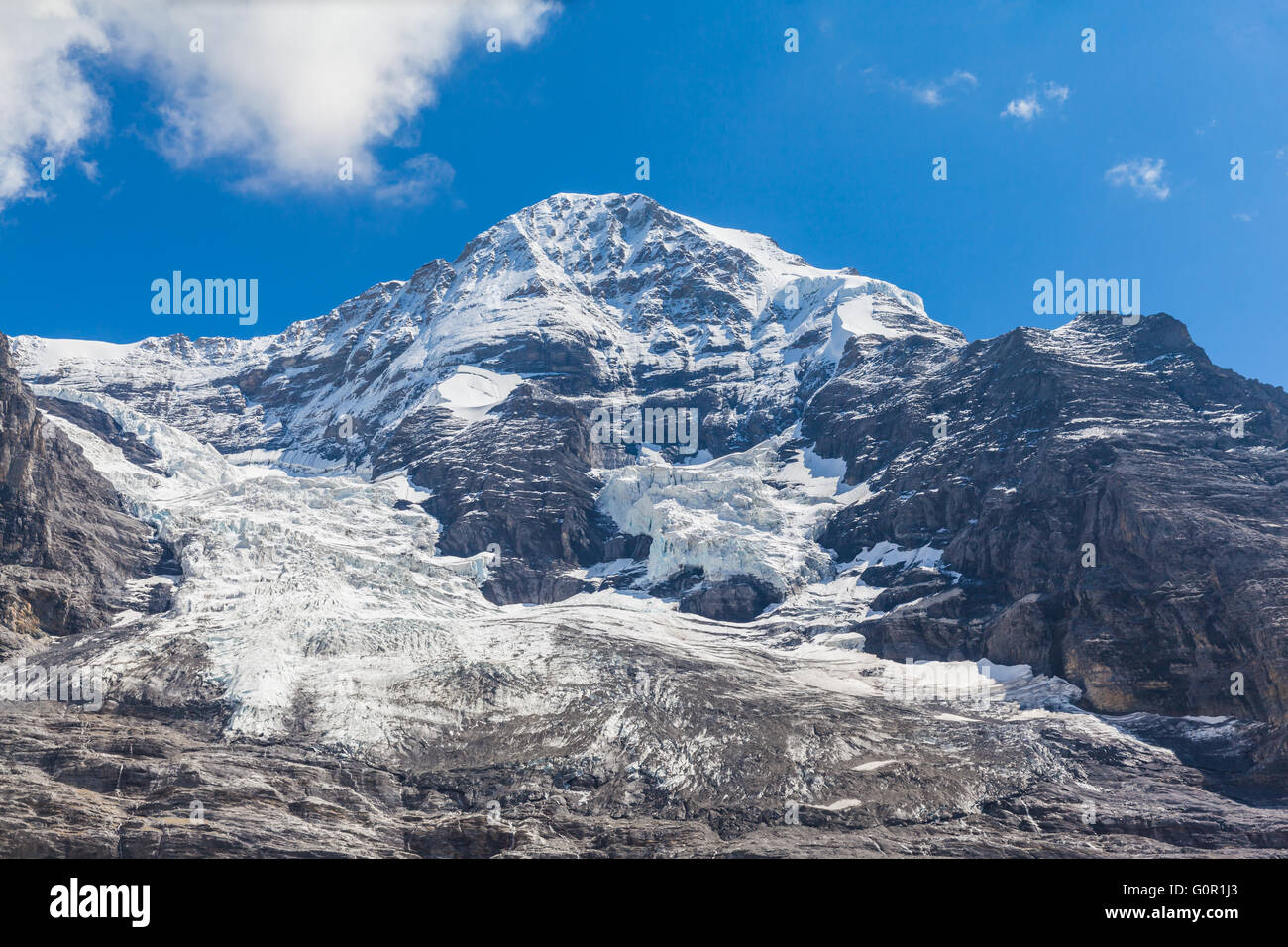 Close view of the famous peak Monch and the Eiger glacier of the swiss ...