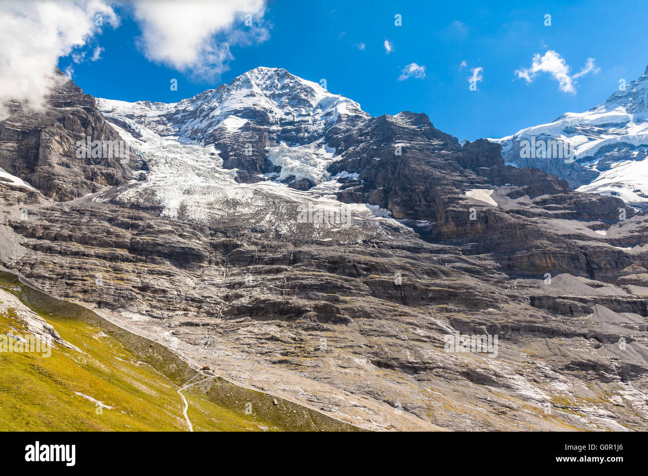 Close view of the famous peak Monch and the Eiger glacier of the swiss ...