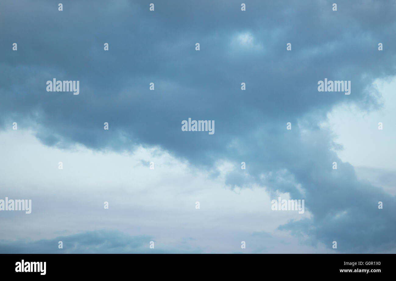 Stormy gray blue cloudy sky with clouds color photo Stock Photo - Alamy