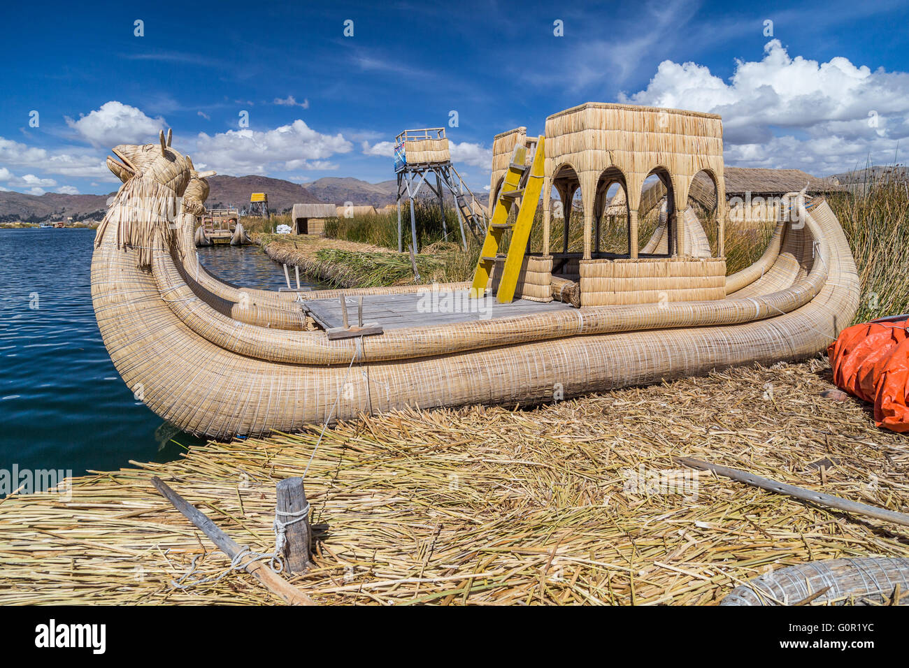 Canoe boat at Uros floating island and village on Lake Titicaca near ...