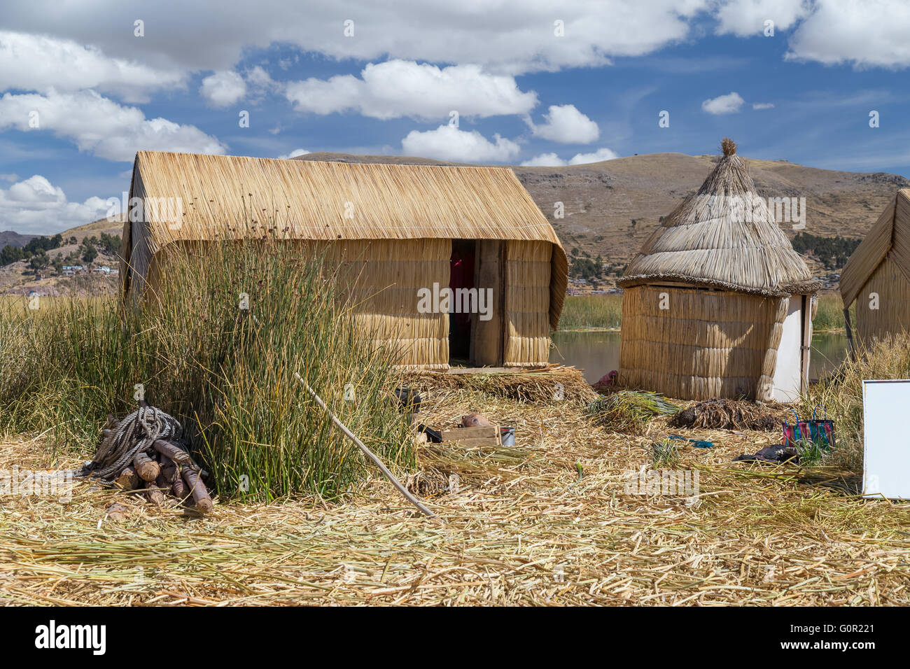 Huts at Uros floating island and village on Lake Titicaca near Puno ...