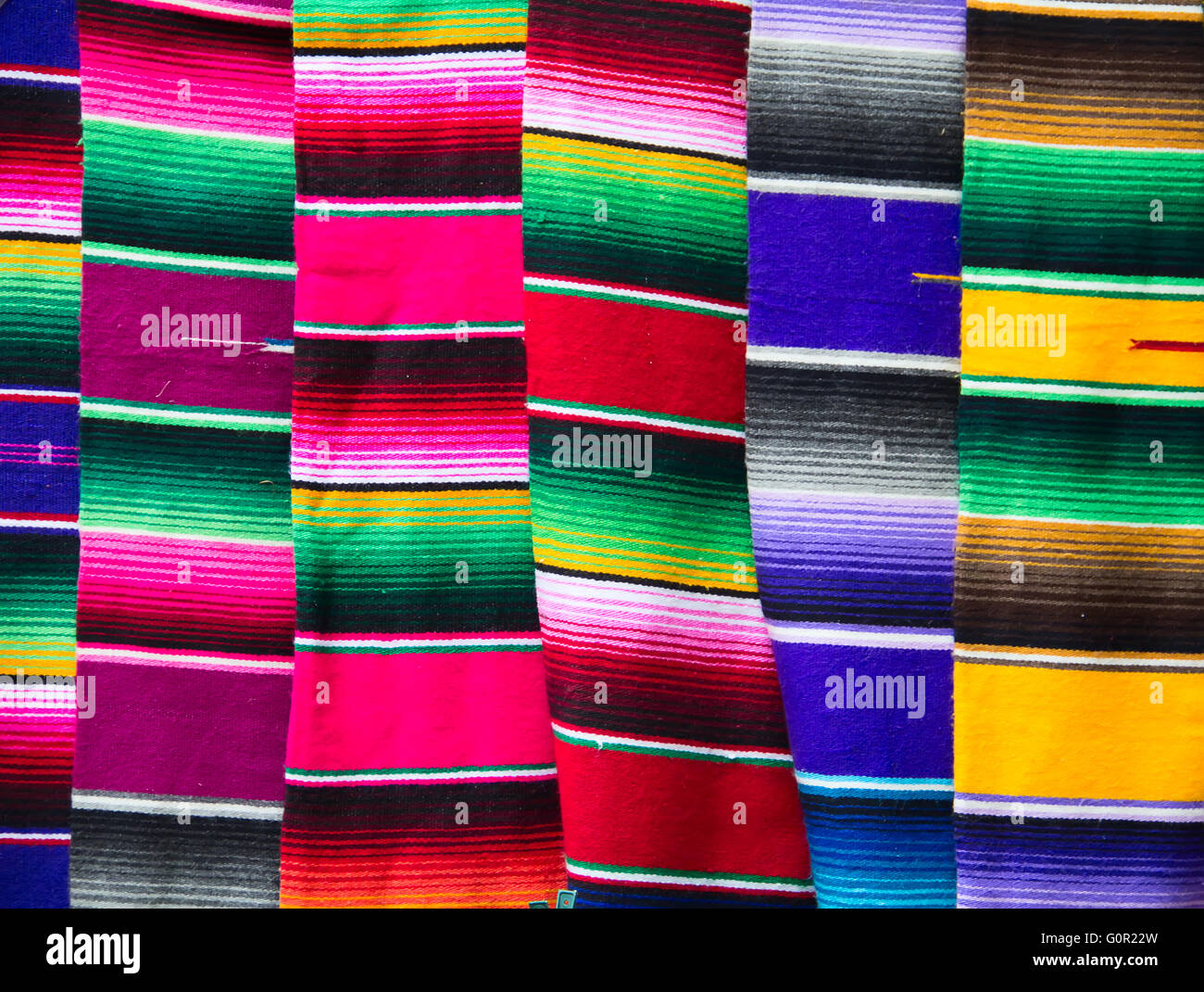 Traditional mexican bright stripped fabric on the market Stock Photo ...