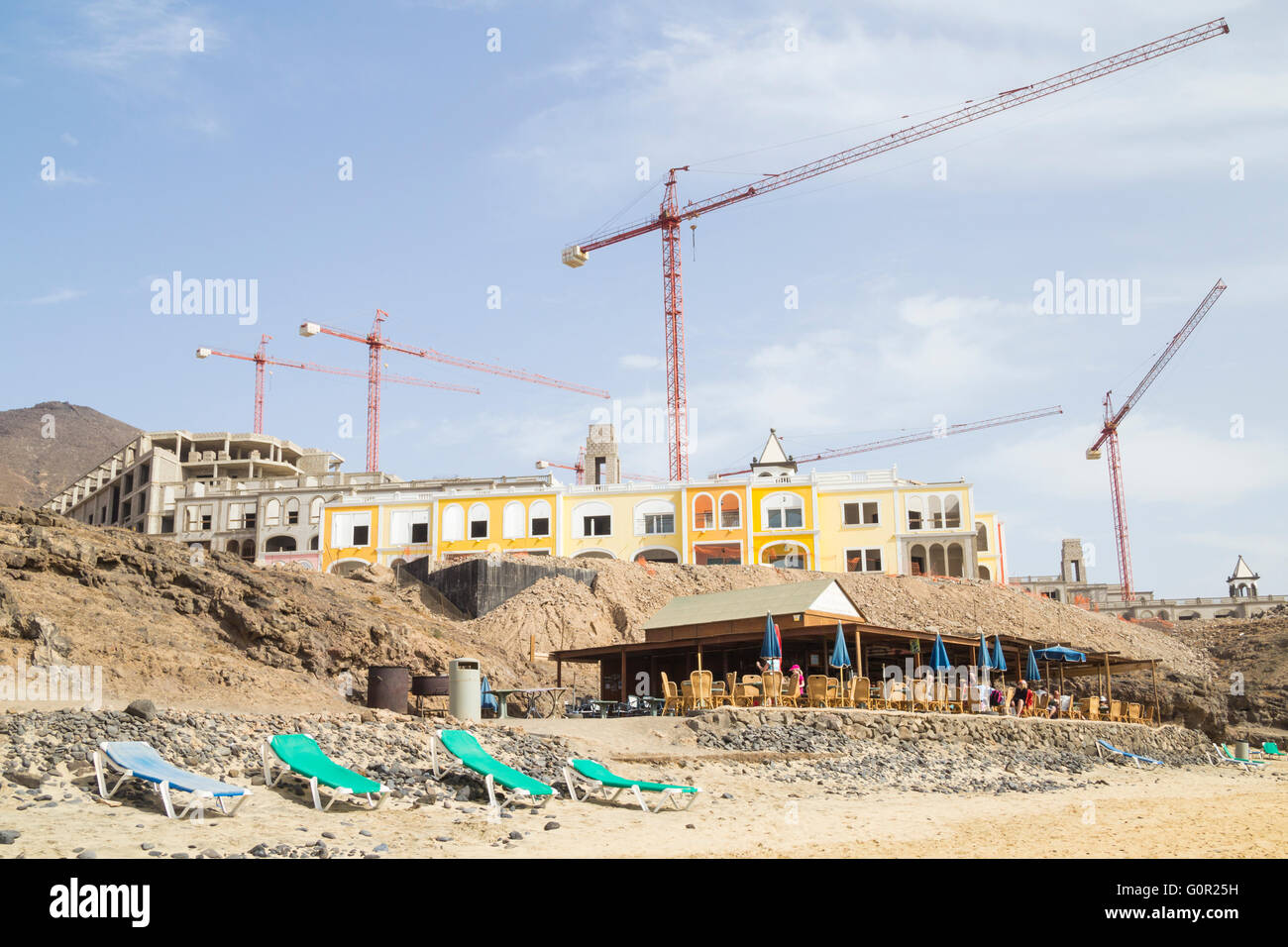 Unfinished/ hotel construction site overlooking beach bar in Spain ...
