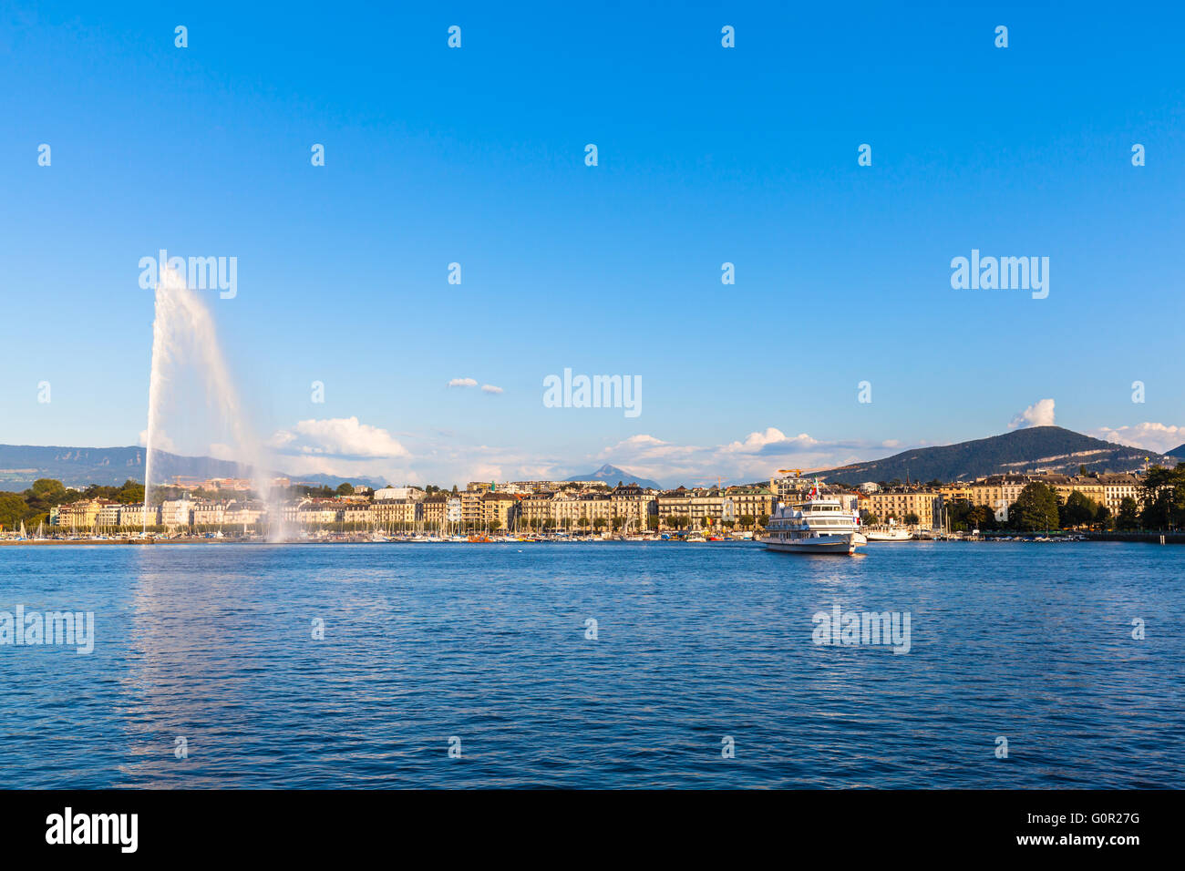 Beautiful view of the water jet fountain in the lake of Geneva and the ...