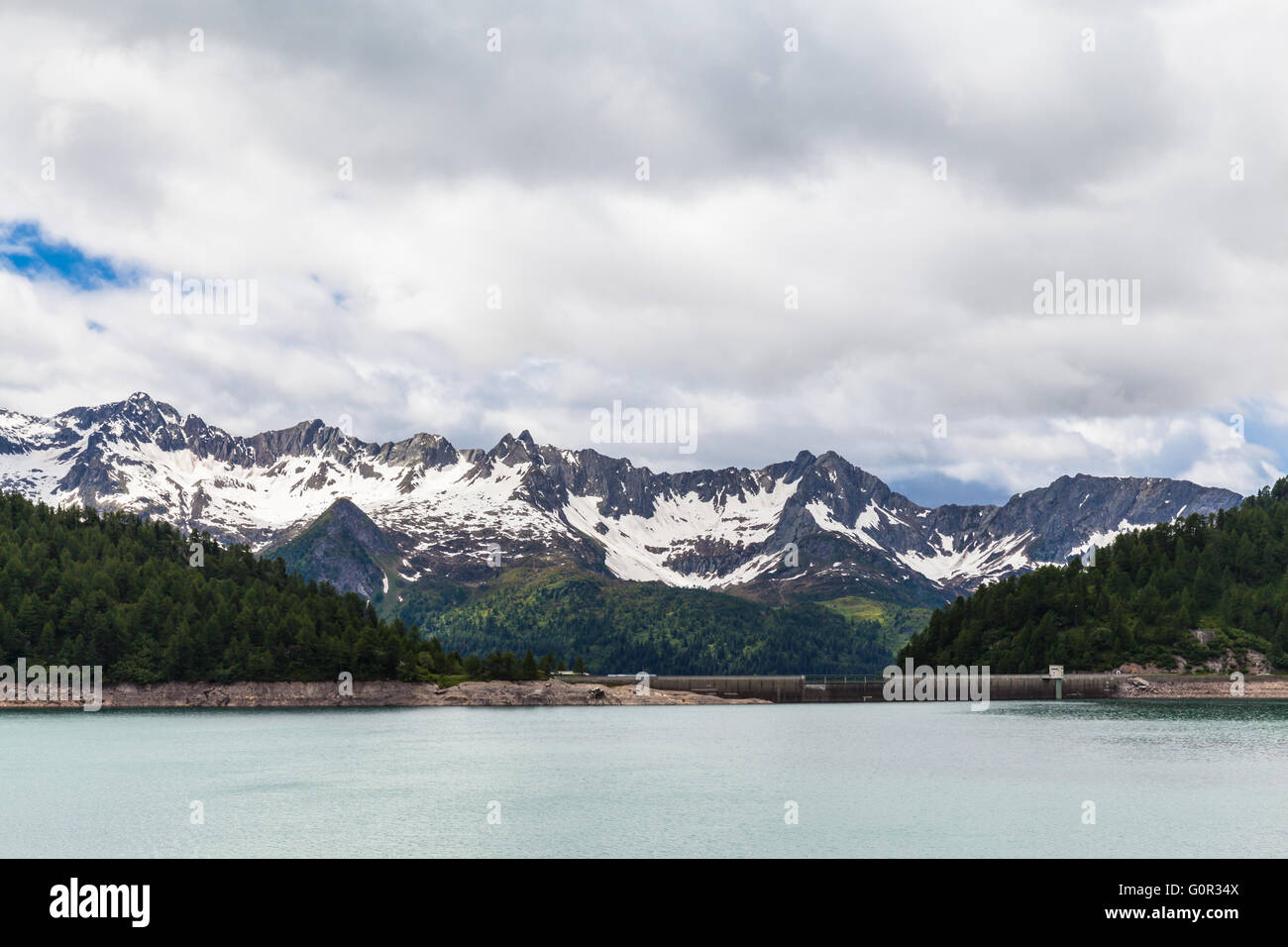 Panorama view of the lake of Ritom and the dam with the alps in ...