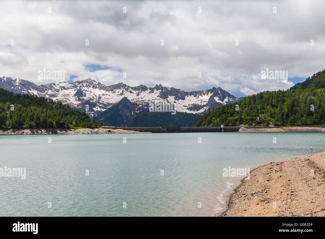 Panorama view of the lake of Ritom and the dam with the alps in ...