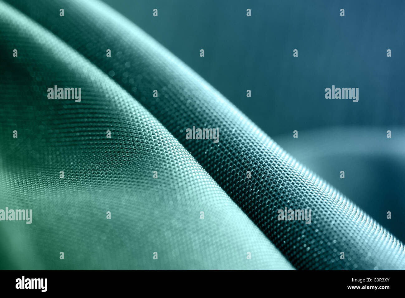 Textile and fabric industry background Stock Photo - Alamy