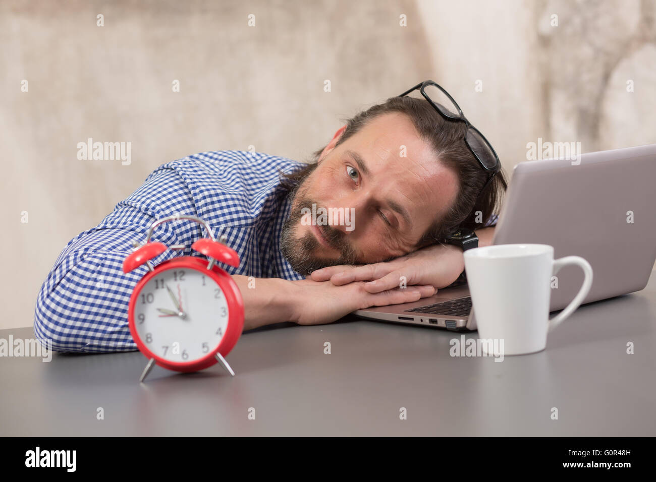 Very tired businessman Stock Photo - Alamy