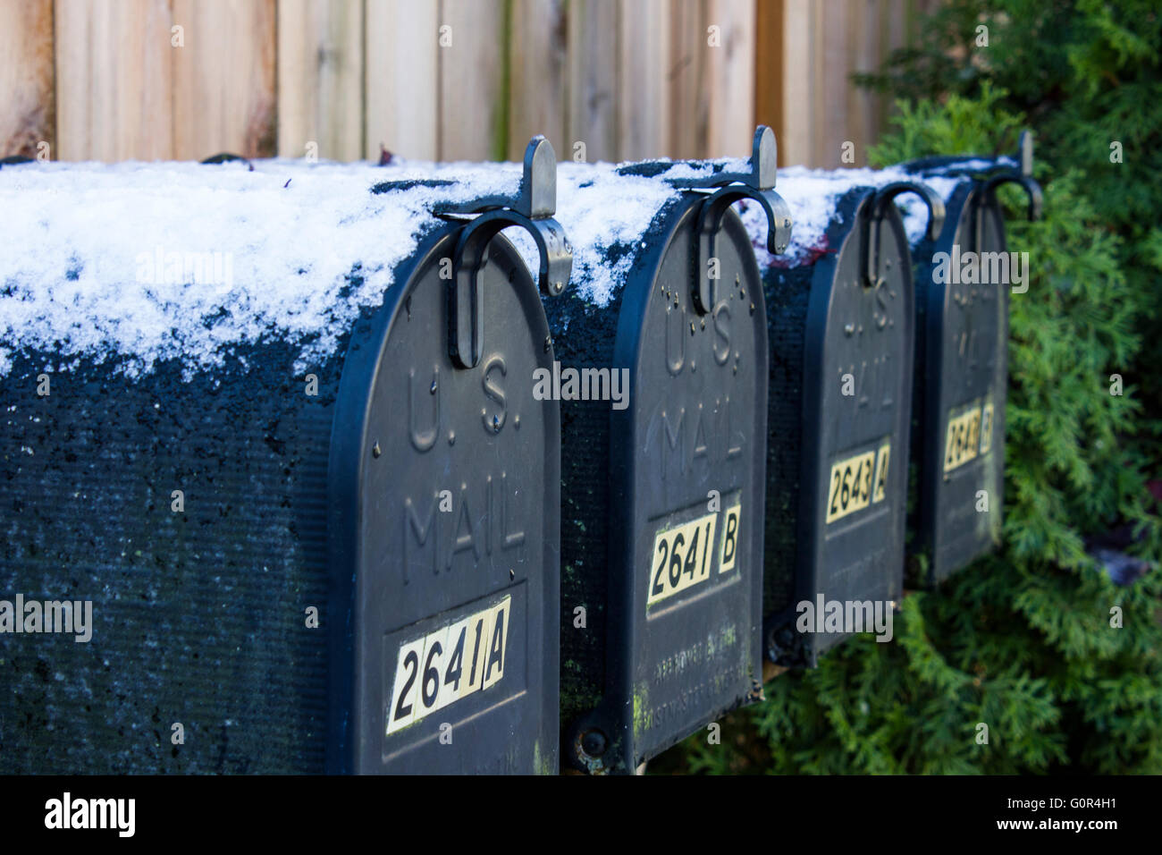Row of Rounded Mailboxes after Snow Fall Stock Photo - Alamy