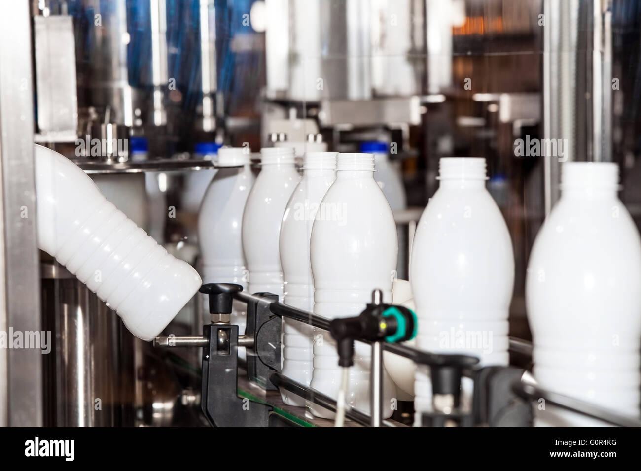 Packaging milk bottles line Stock Photo - Alamy