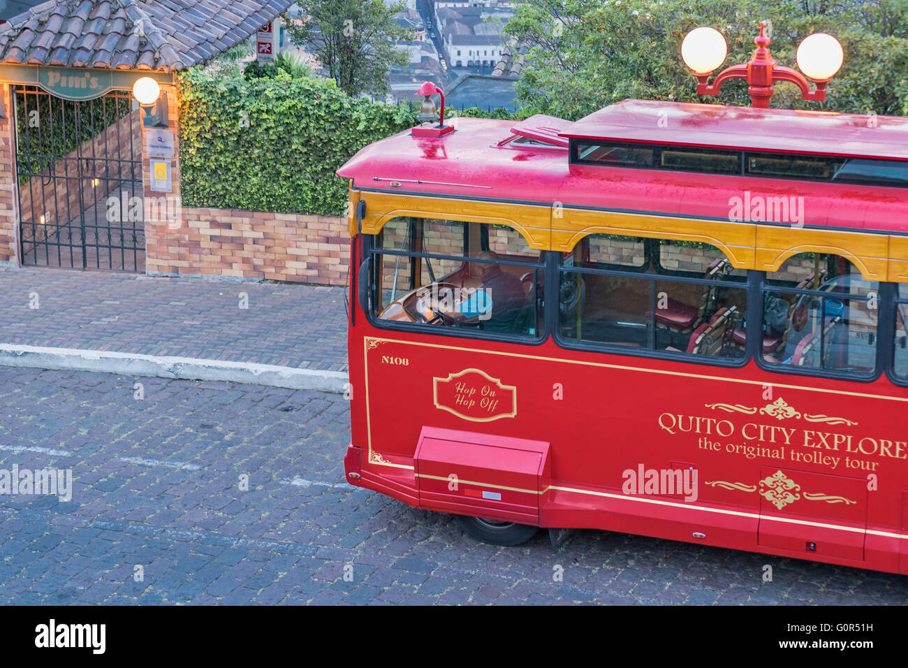 QUITO, ECUADOR, OCTOBER - 2015 - Touristic bus at cobblestone street at ...