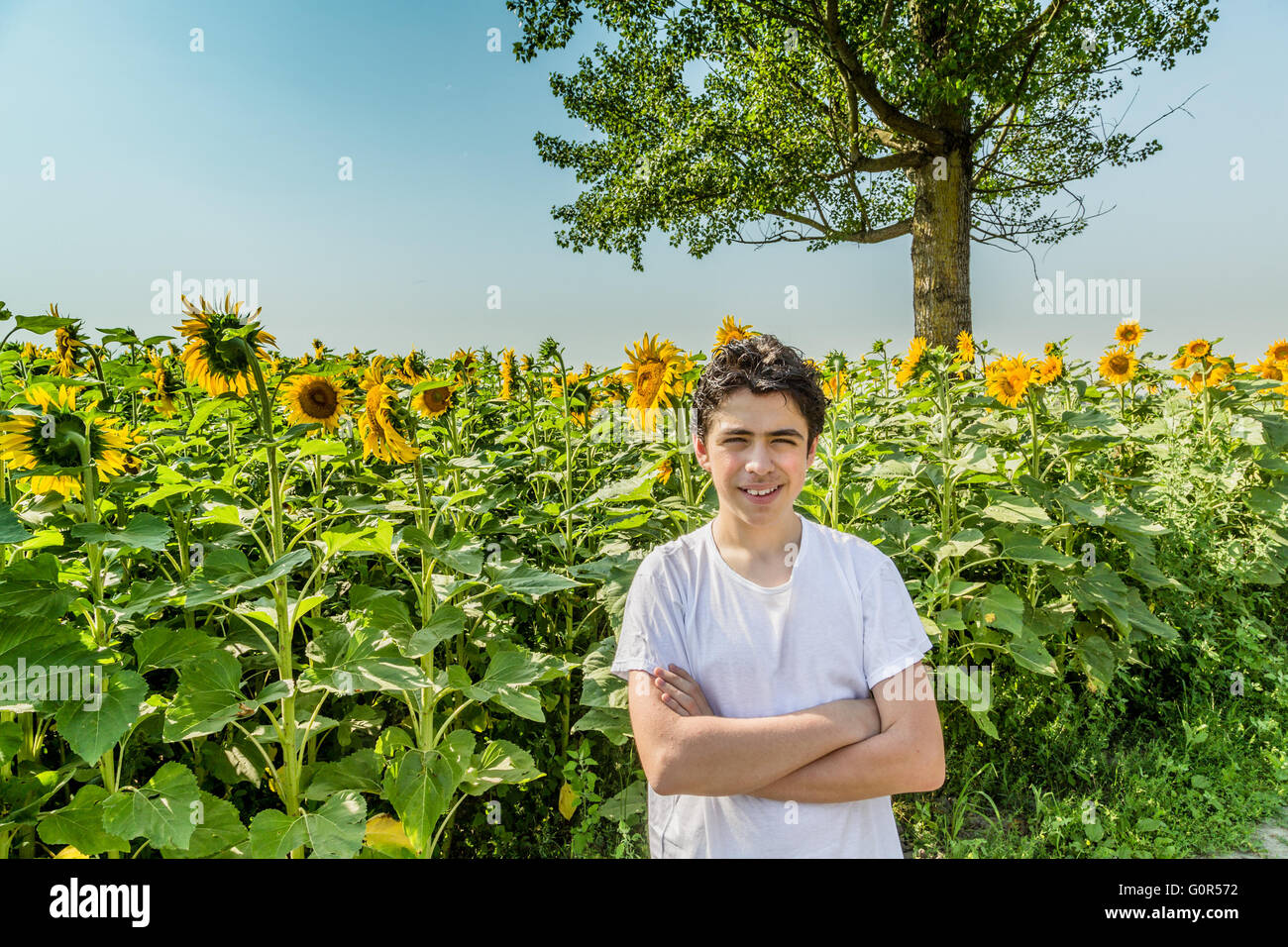 Open air and open arms, Caucasian boy is crossing his arms in front of ...