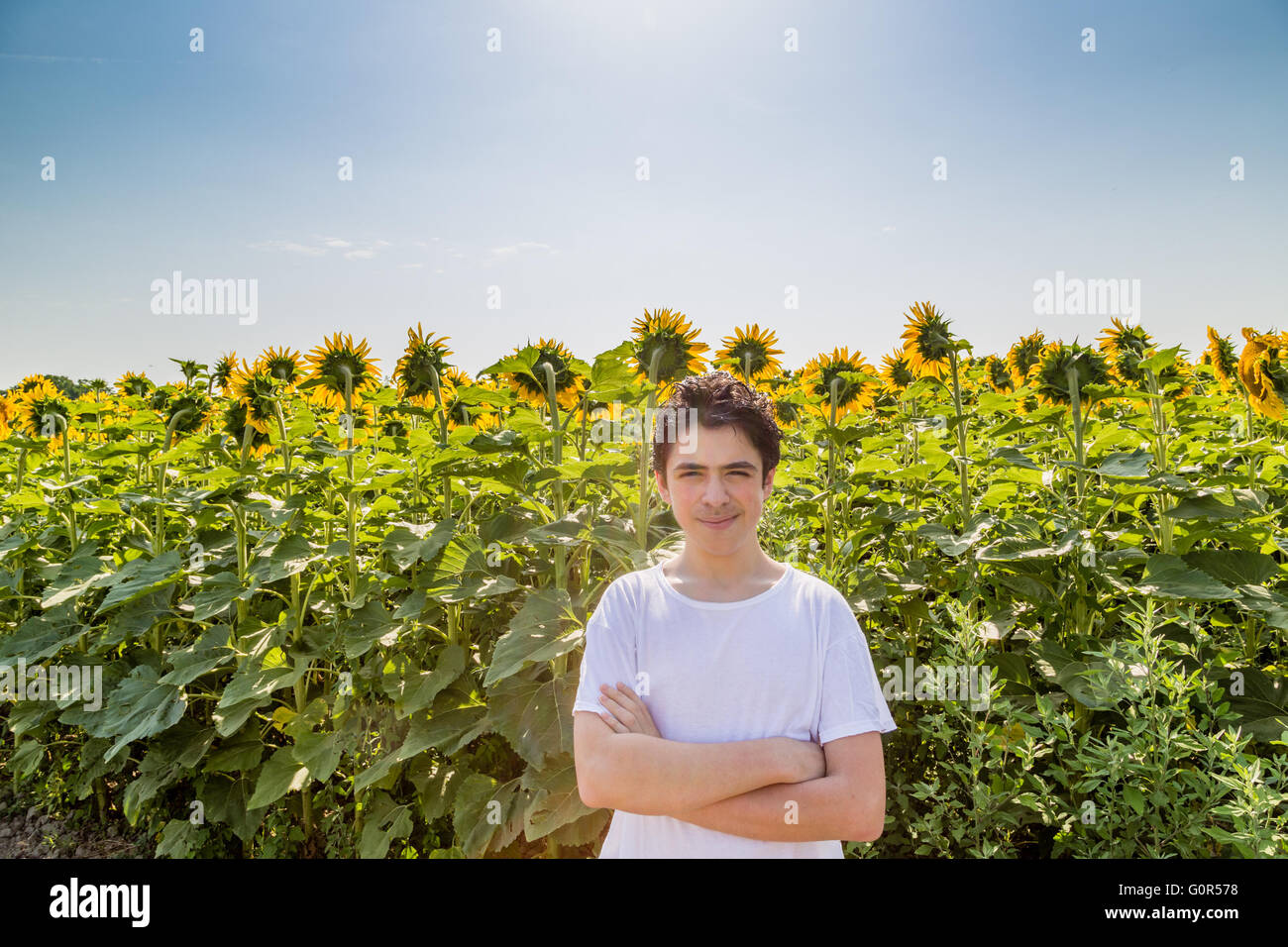 Open air and open arms, Caucasian boy is crossing his arms in front of ...