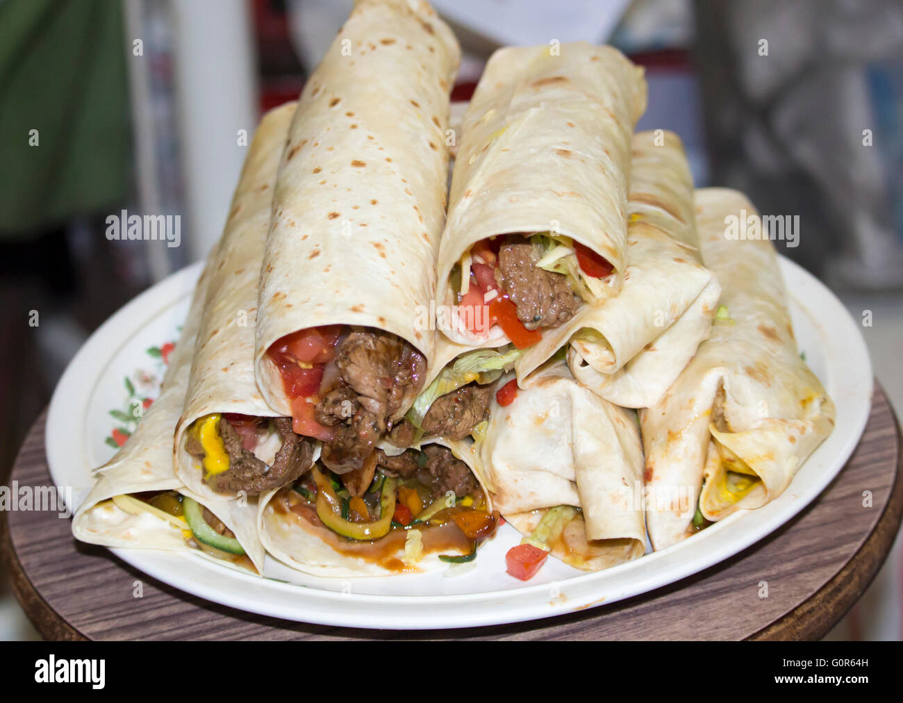 Healthy flat bread wraps with braised beef gravy and vegetables a ...