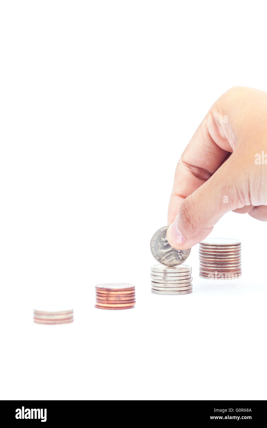 Woman hand putting money coin for saving money concept Stock Photo - Alamy