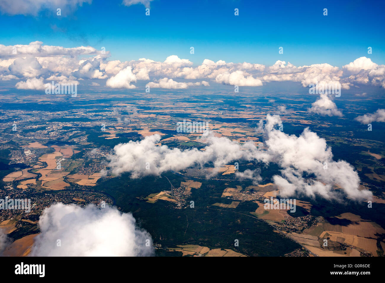 view of the earth landscape from an airplane above the clouds Stock ...