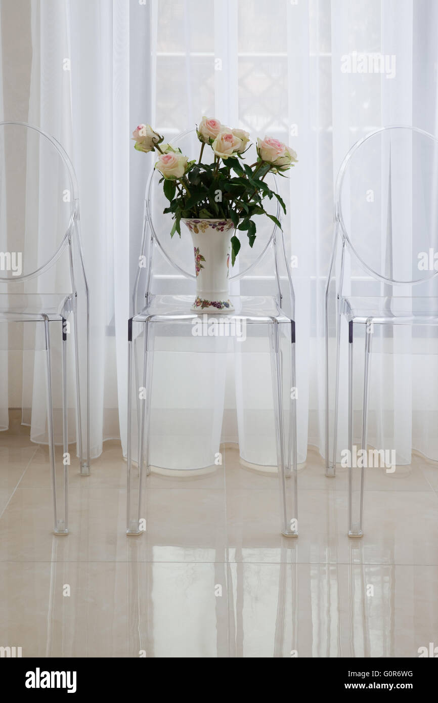 Bouquet of flowers on a chair in modern flat Stock Photo - Alamy