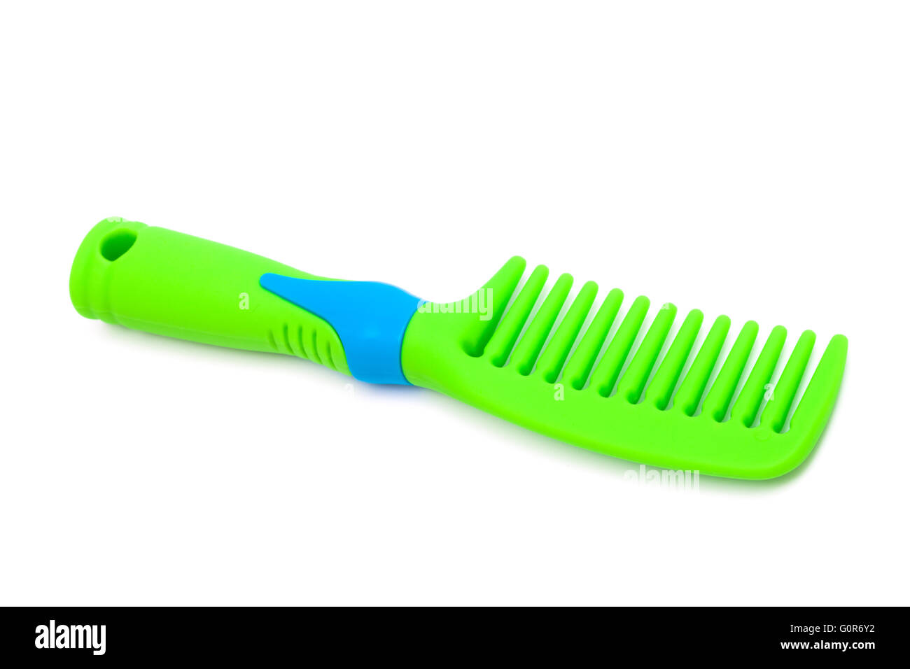Close up green comb with hair hi-res stock photography and images - Alamy