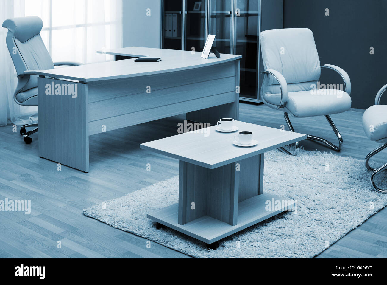 Cups from coffee on a table at modern office Stock Photo - Alamy