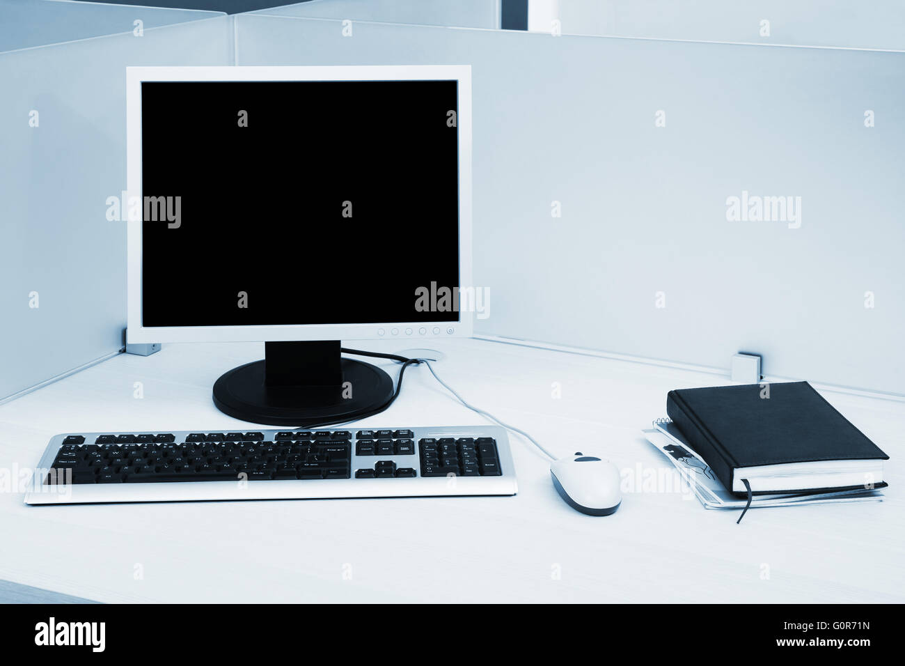 computers behind the glass in a modern office Stock Photo - Alamy