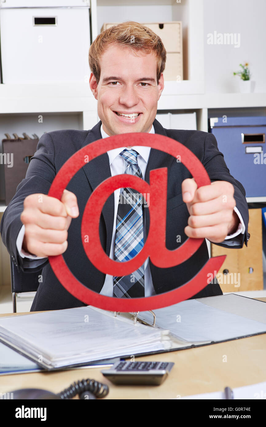 Happy business man holding a red internet sign in the office Stock ...