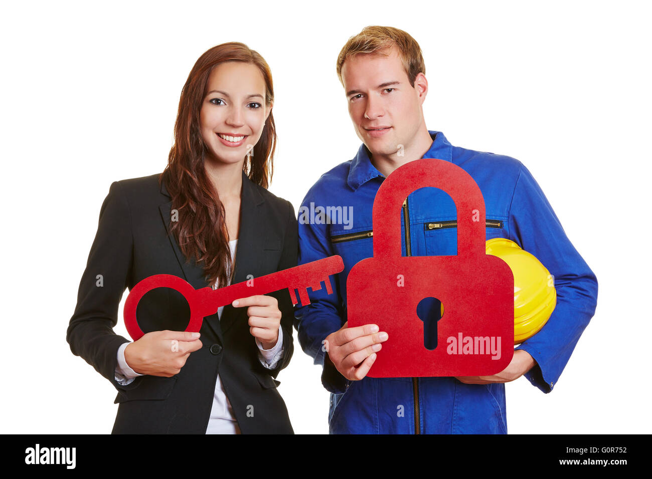 Businesswoman and construction worker holding key and lock as symbol ...