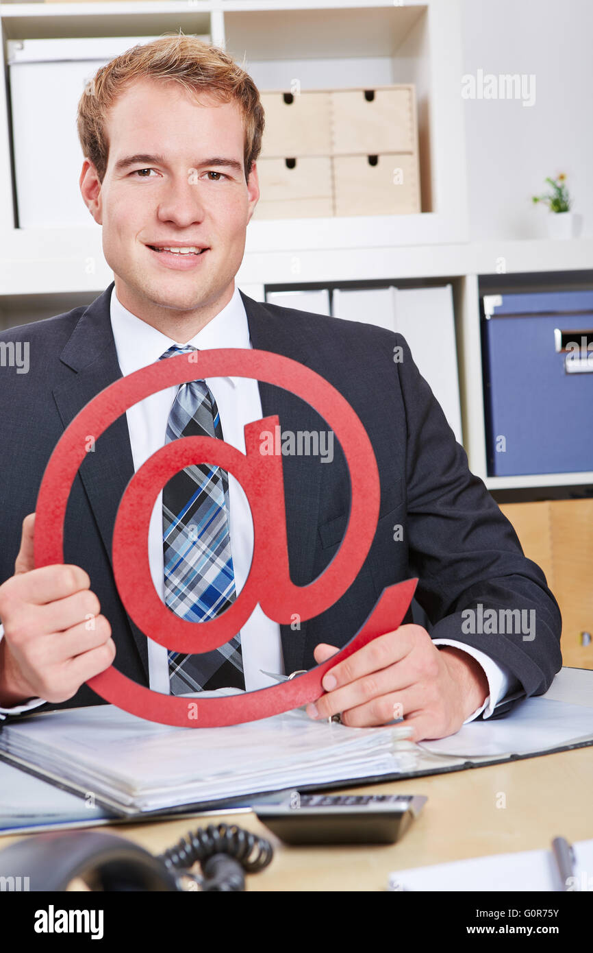 Business man holding a red internet at sign in the office Stock Photo ...