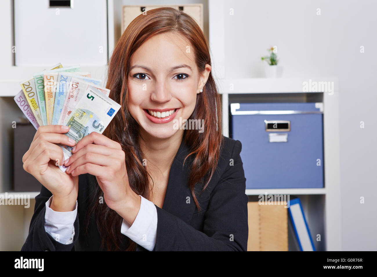Happy smiling business woman with Euro money bills in the office Stock ...