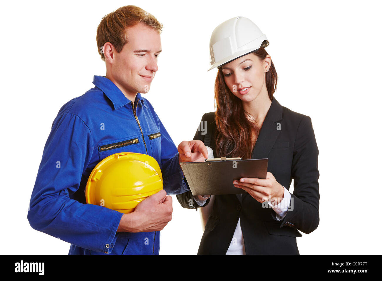 Construction worker and engineer working with a clipboard Stock Photo ...