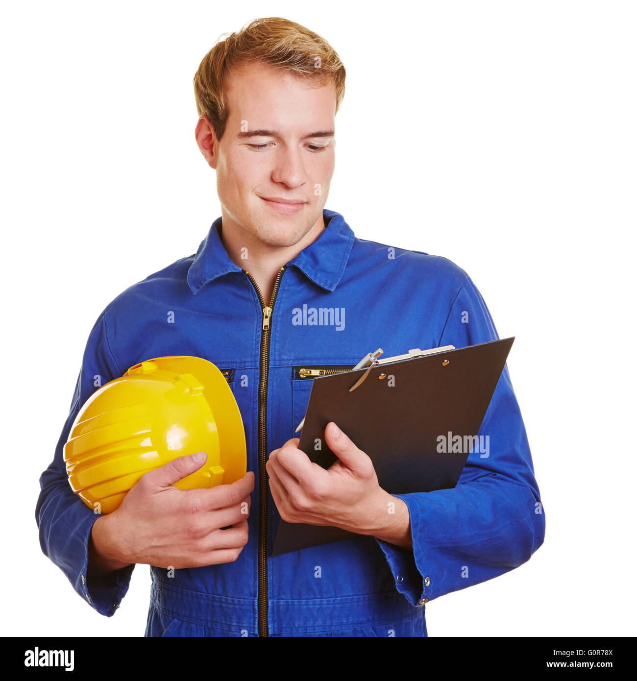 Construction worker with clipboard and helmet looking at checklist ...